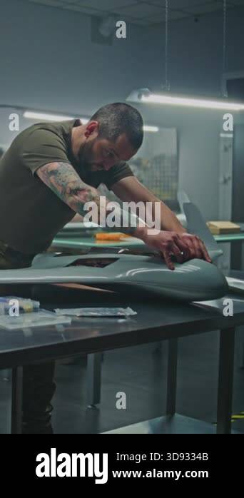 Engineer Assembling Drone Internal Components, While Professional Team ...