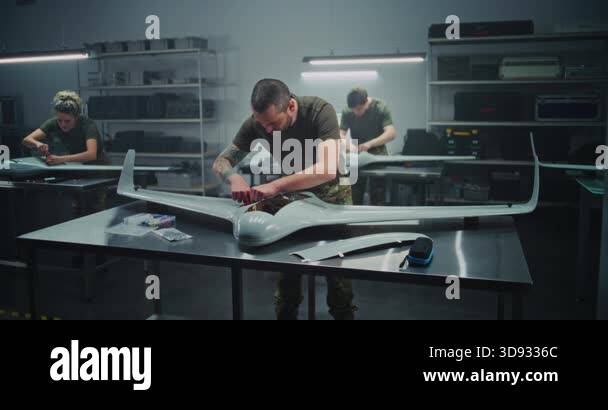 Synchronized Drone Production Team Simultaneously Assembling Large UAV ...