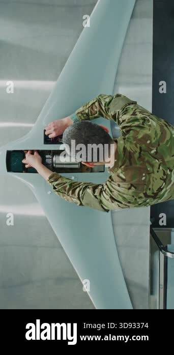 Engineer in Military Uniform Assembling Unmanned Aerial Vehicle. Man in ...