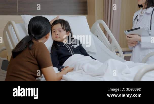 Hospital concept of 4k Resolution. An Asian mother is comforting her ...