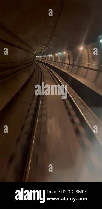 A dynamic underground metro scene captured while the train is moving ...