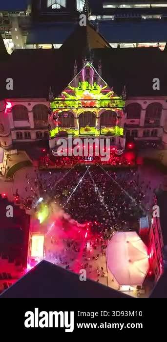 A disco party with a crowd of people on the dance floor at night ...