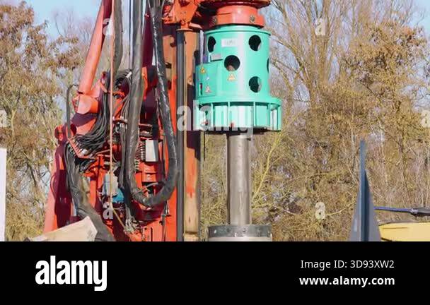 Germany Berlin November 27, 2025. Industrial drilling rig with a green ...