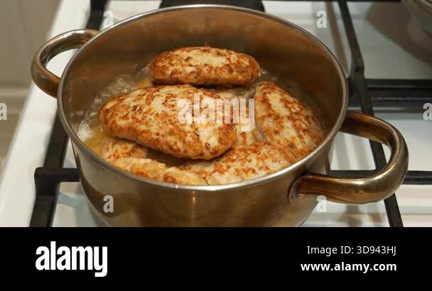 Cooking, stewing meat. Meat cutlets are stewed in saucepan Stock Video Footage - Alamy
