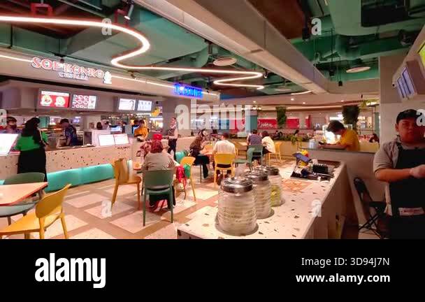 High quality 4K footage of People are enjoying dinner at the mall with ...