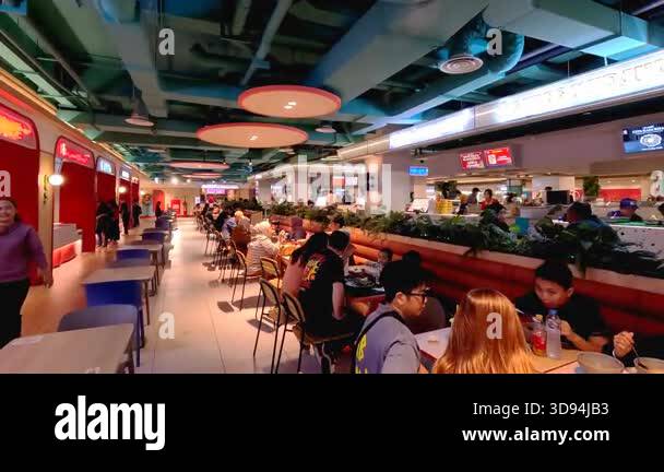 High quality 4K footage of People are enjoying dinner at the mall with ...