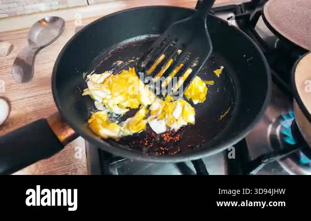 Fried eggs in a frying pan. 4K Fried eggs in a frying pan for breakfast ...