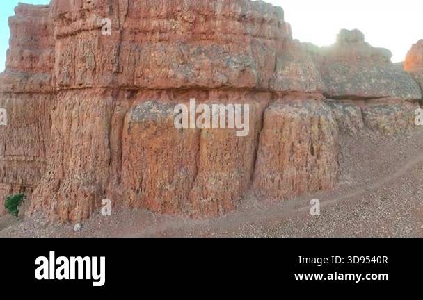 Aerial fly through Red Canyon in Utah highlights rugged red rock cliffs ...