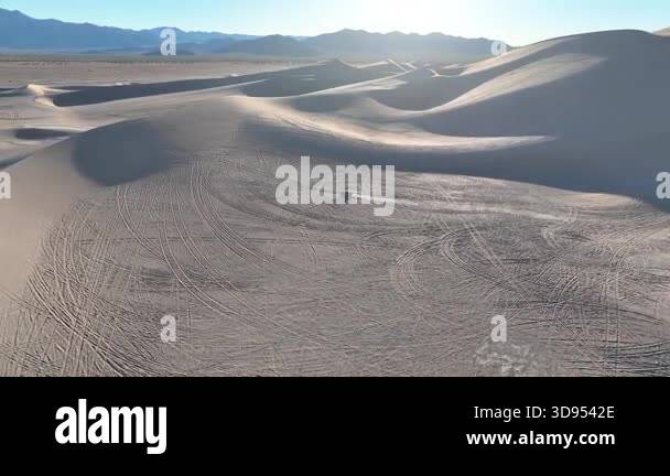 Sweeping aerial views orbit around an off-road vehicle traversing Big ...