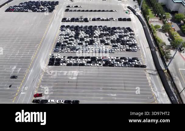 Aerial view of a large automotive logistics terminal with hundreds of ...