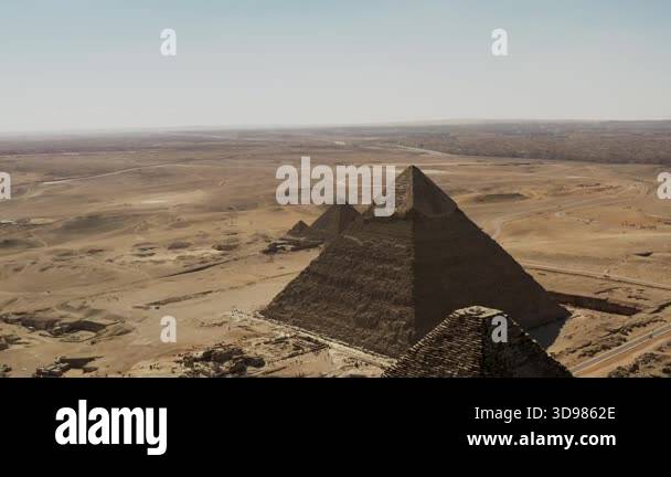 Aerial view of the Giza pyramids captured by a drone, showcasing the ...