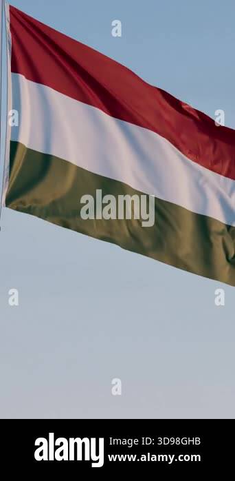 Hungary, Budapest: Cinematic Vertical Waving National Flag Against Blue ...