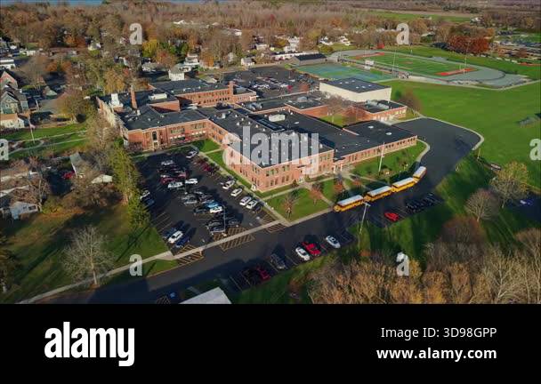 Aerial view of a typical American school in a small town, with brick ...