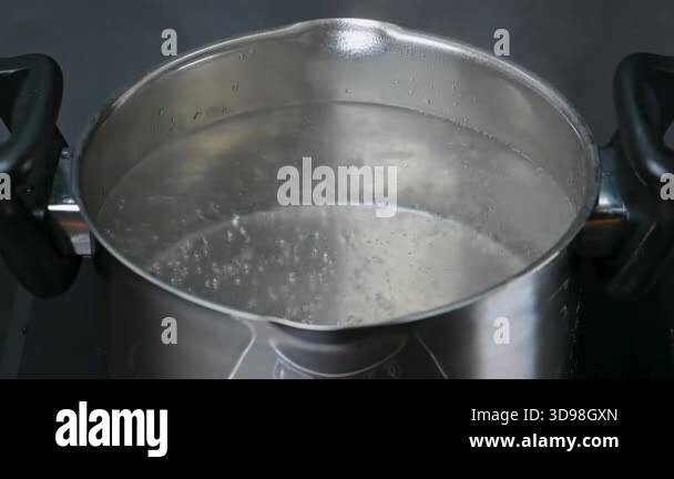 Video of water heating in a saucepan Stock Video Footage - Alamy