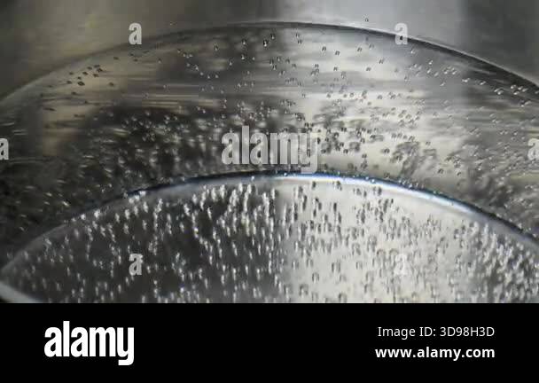 Video of water heating in a saucepan Stock Video Footage - Alamy