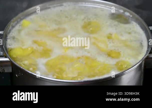 Video of boiling potatoes in a saucepan Stock Video Footage - Alamy