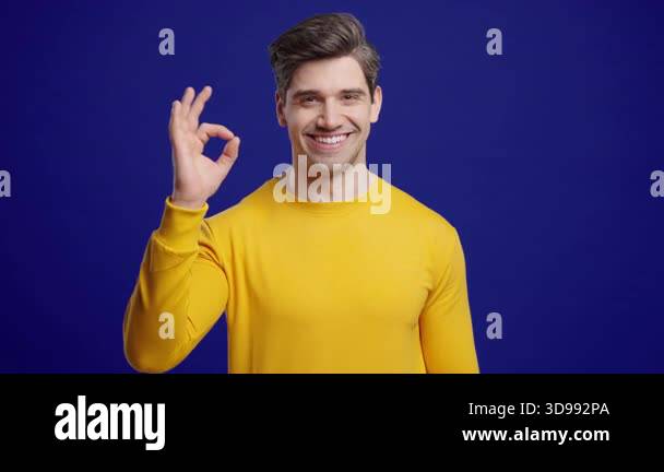 Positive mature 30s man makes OK, okay hand sign gesture. Happy guy ...