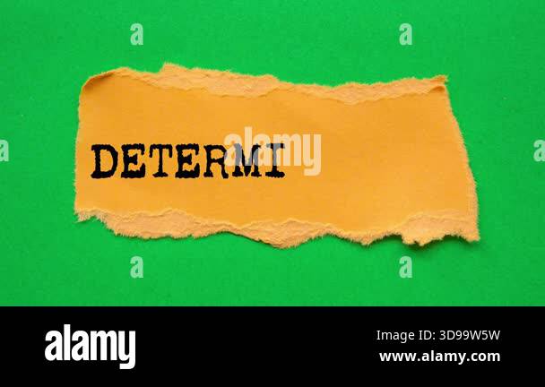 Determination message written on ripped torn paper background ...