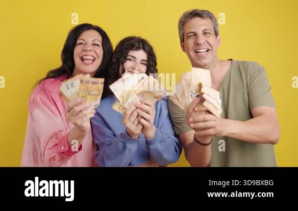 Joyful family celebrating a lottery win. Excited mother, father, and ...