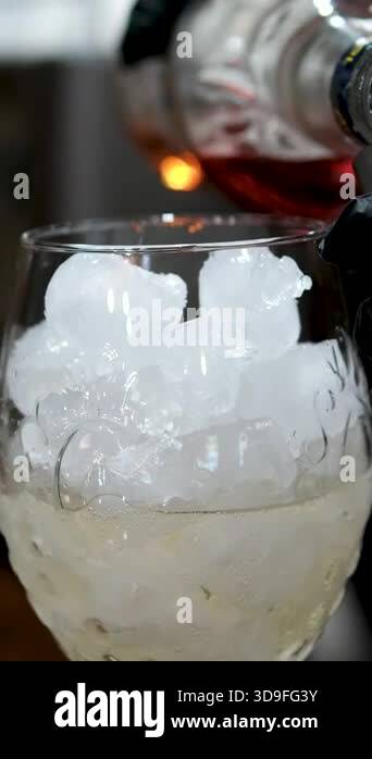 Aperol in glass preparation Bartender adding fresh ingredients to a ...