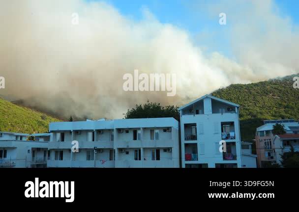 Chan, Montenegro, August 11 2025: Fire in mountains over village ...