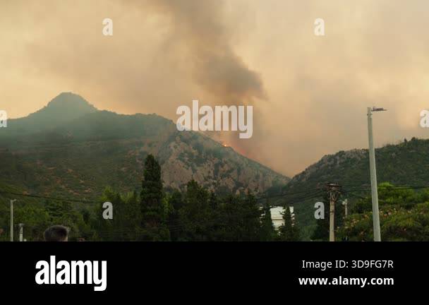 Chan, Montenegro, August 11 2025: Fire in mountains over village ...