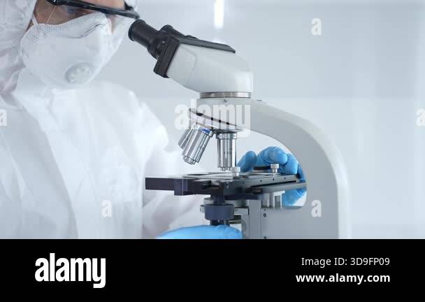 Medical virologist in a hazmat suit, mask, and gloves, diligently ...