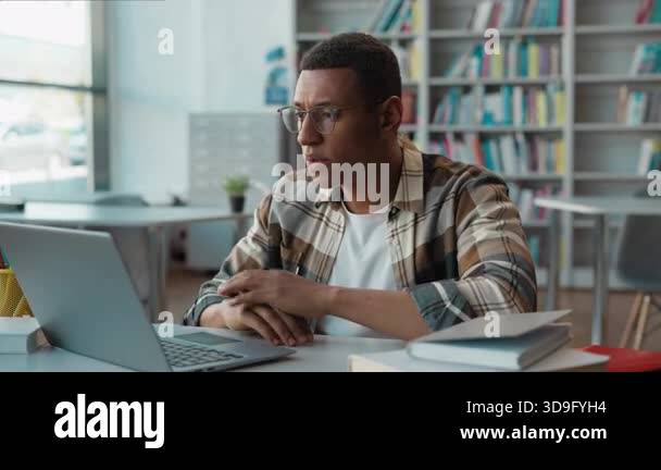 Stressed frustrated African American man burnout student holding head ...