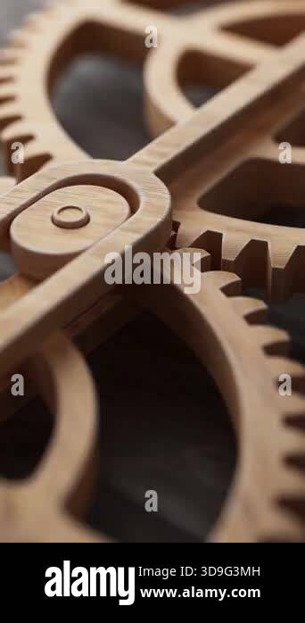 Looping animation of two wooden gears connected by a mechanical shaft ...