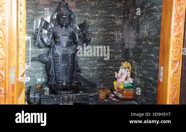 hindu holy black stone shani dev idol placed inside traditional temple ...