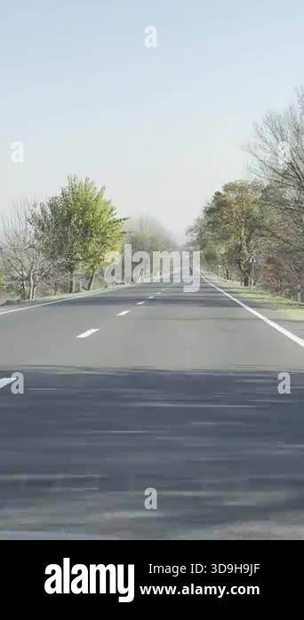 Video taken from inside the car. Traffic. asphalt road surrounded by ...