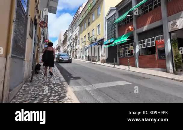 Lisbon summer street pov walk in historic center Portugal with colorful ...