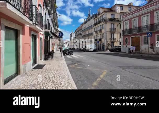 Lisbon historic street pov walk in summer with warm light and colorful ...