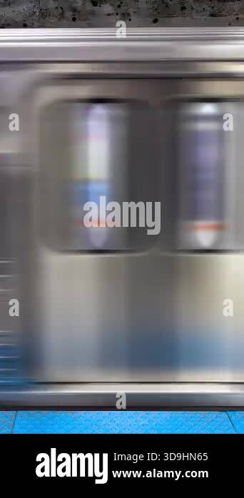 A vertical view close-up of modern stainless steel subway train doors ...