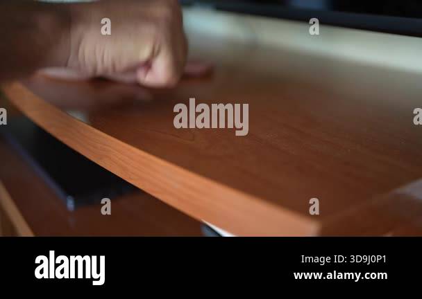 A captivating series of hand gestures on a polished wooden surface ...