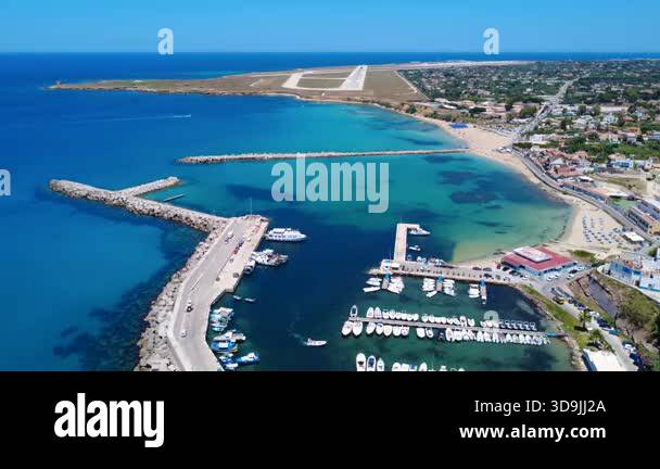 Boats Docked in a Beautiful Harbor Near a Sandy Beach on a Sunny Day in ...