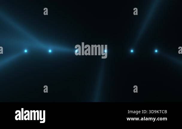 horizontal blue spotlights across dark arena with sweeping beams and ...