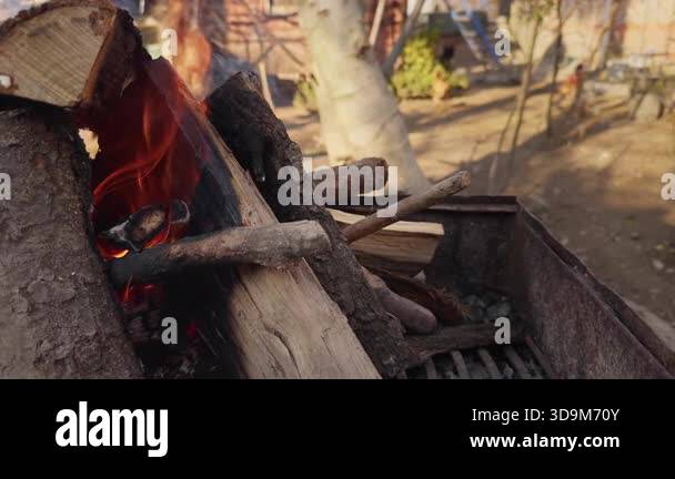 Burning Oak Wood in a Farmhouse Garden Stock Video Footage - Alamy