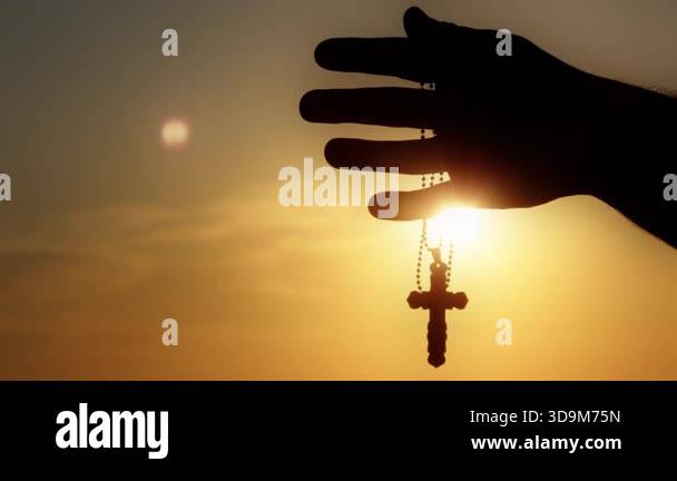 Male Hand is Holding Christianity Religion Symbol Cross in Sunset Light ...