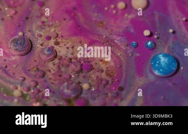 Vibrant fluid spill. Ink art. Defocused blue purple pink colorful flow ...