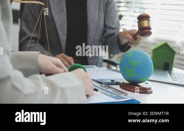 Professionals discussing sustainable and eco-friendly real estate ...