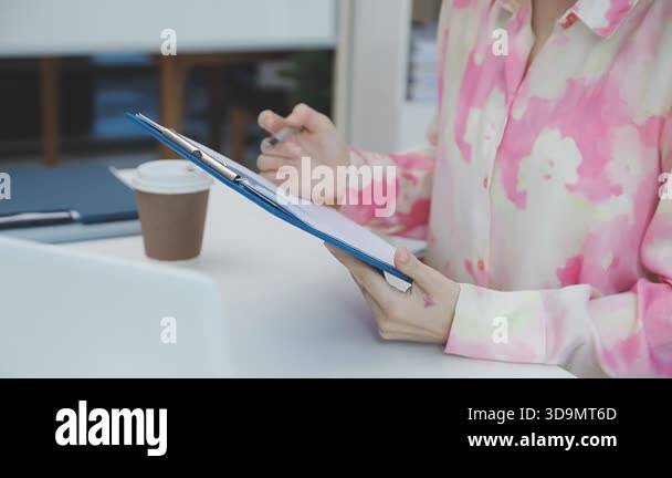 Two financial accountants analysing business spreadsheets on laptop ...