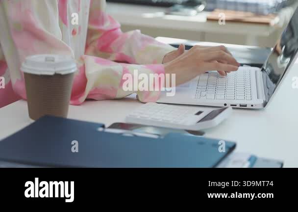 Two financial accountants analysing business spreadsheets on laptop ...