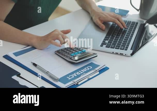 Two financial accountants analysing business spreadsheets on laptop ...