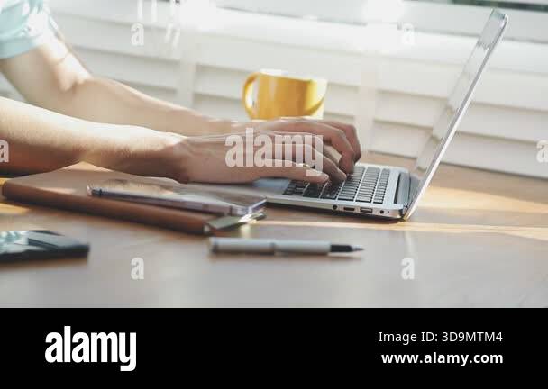 Two financial accountants analysing business spreadsheets on laptop ...