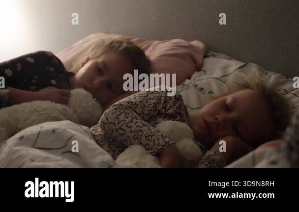 Little triplet sisters sleeping hugging toys. High quality FullHD ...