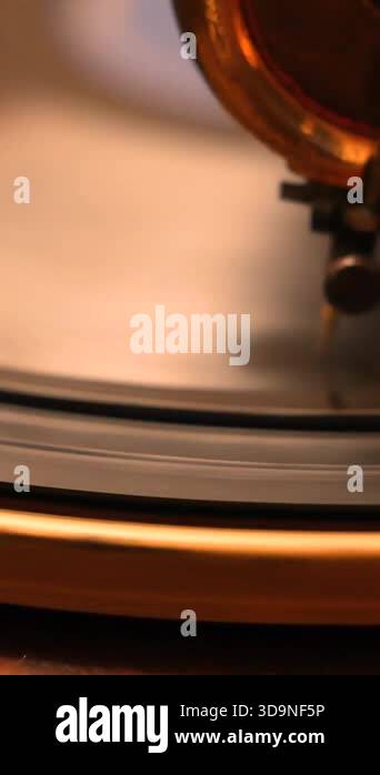 Retro vinyl gramophone from the 1920s with a brass horn and manual ...
