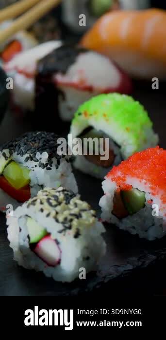 Close-up of various sushi rolls featuring vibrant toppings like black ...