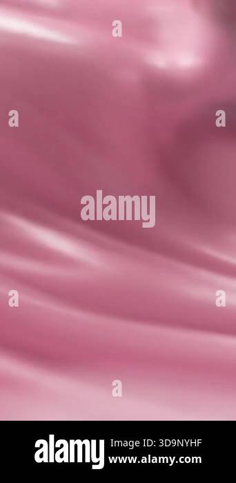 Close up view of light pink cream being whipped creating smooth peaks ...