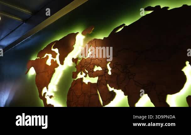 A wooden world map is lit up in a dark room Stock Video Footage - Alamy